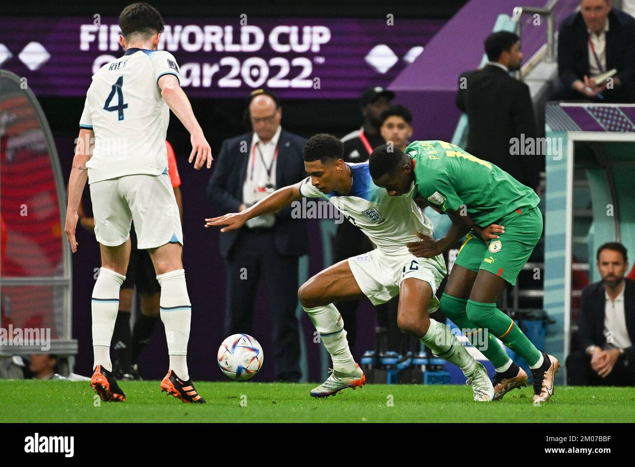 Doha, Qatar. 04th Dec, 2022. Jude Bellingham of England and Pape Matar ...
