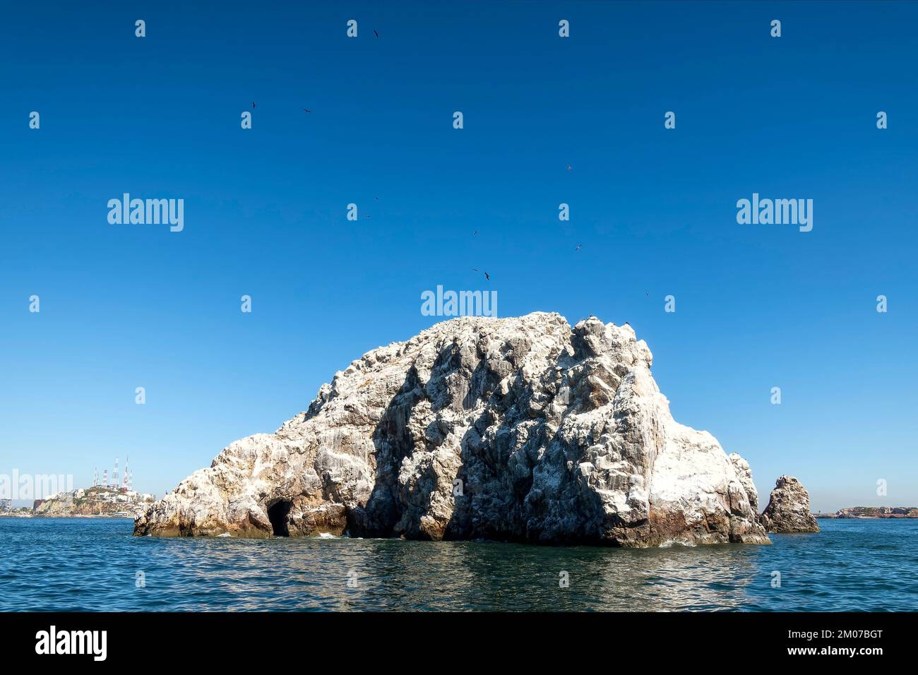 Marine cave in the port of Mazatlan, Sinaloa, Mexico, worn by bird ...