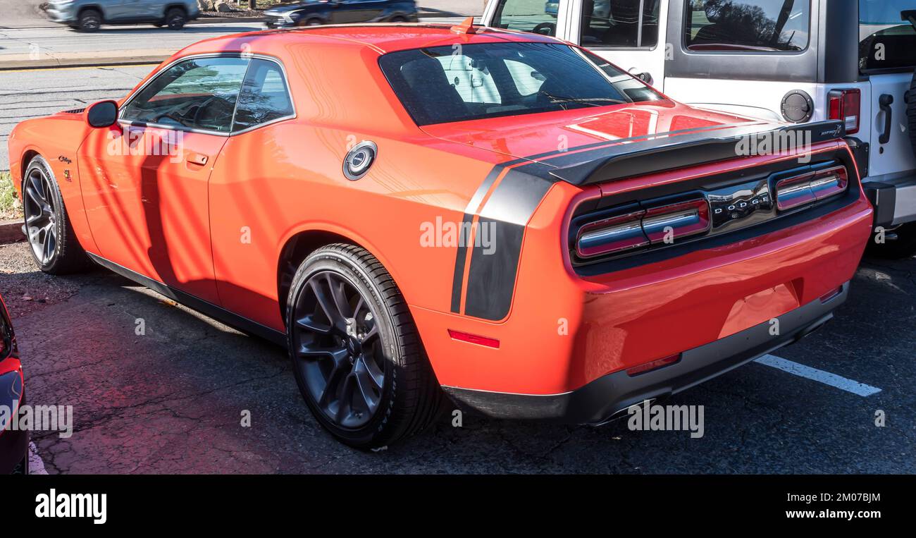 A used, orange Dodge Challenger for sale at a dealership in Ross ...