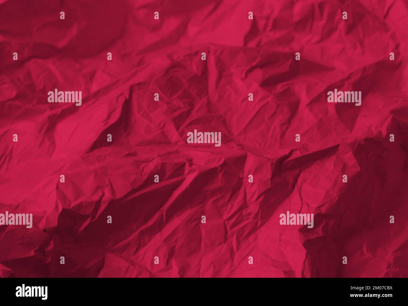 Crumpled paper Viva Magenta color of the year 2023. Texture crumpled ...