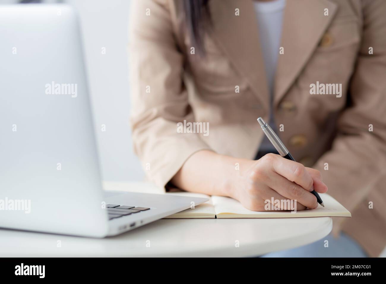 Closeup hands young asian woman writing on notebook for planning ...