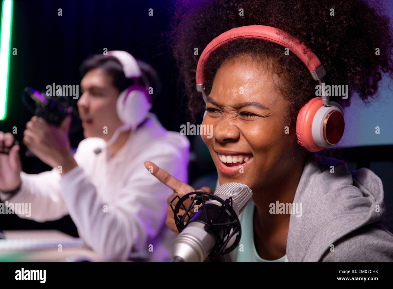 Young African American woman and asian man a podcast interview and ...