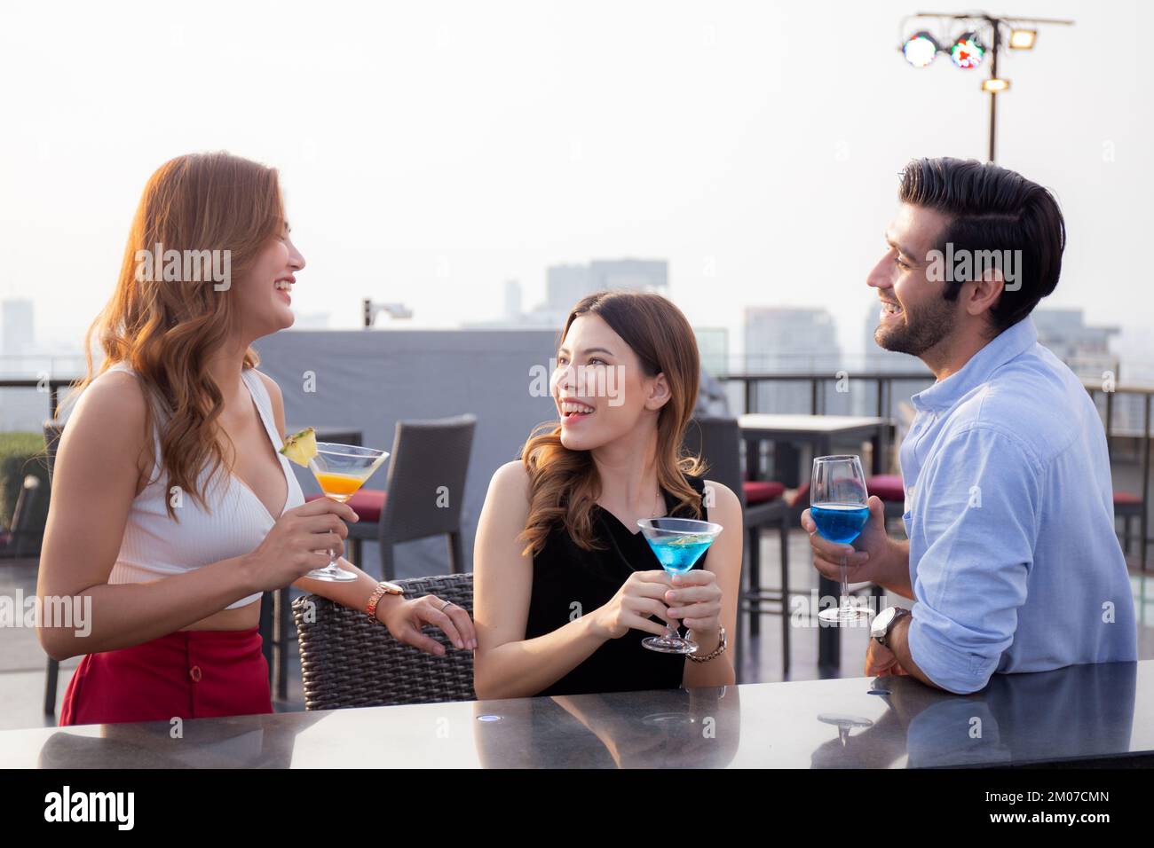 Group friends drinking cocktail and cheer in party at restaurant luxury ...