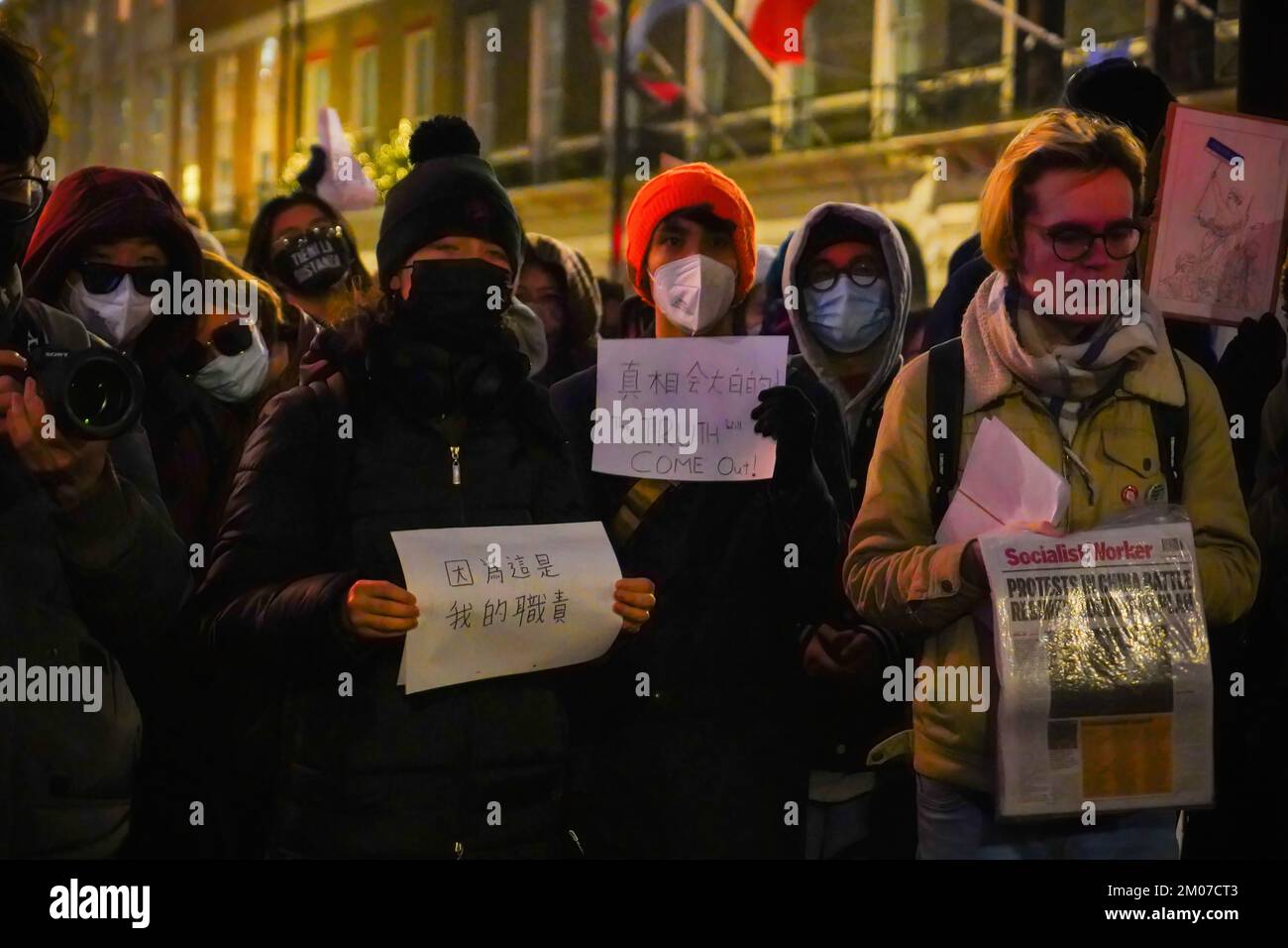 London, UK. 05th Dec, 2022. Protesters hold placards during a ...