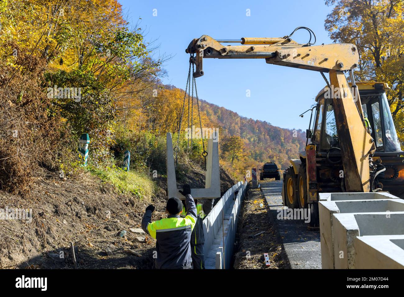Installation of concrete drains precast in u-shapes on reconstruction ...