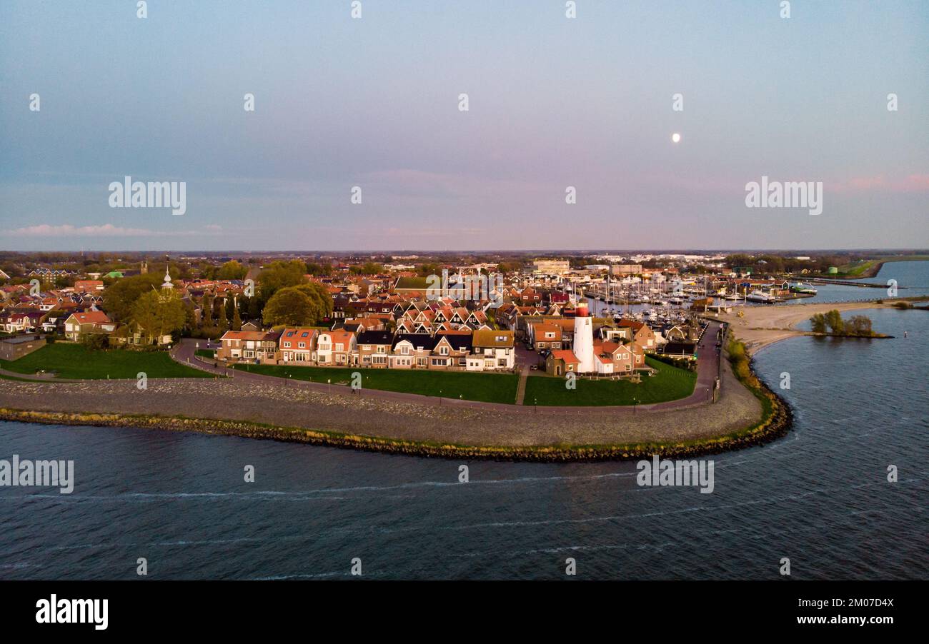 Urk Flevoland Netherlands sunset at the lighthouse and harbor of Urk ...