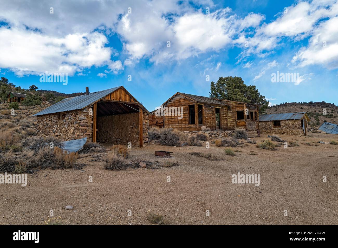 Shacks line a gravel street of an abandoned mercury mine in Nevada, USA ...