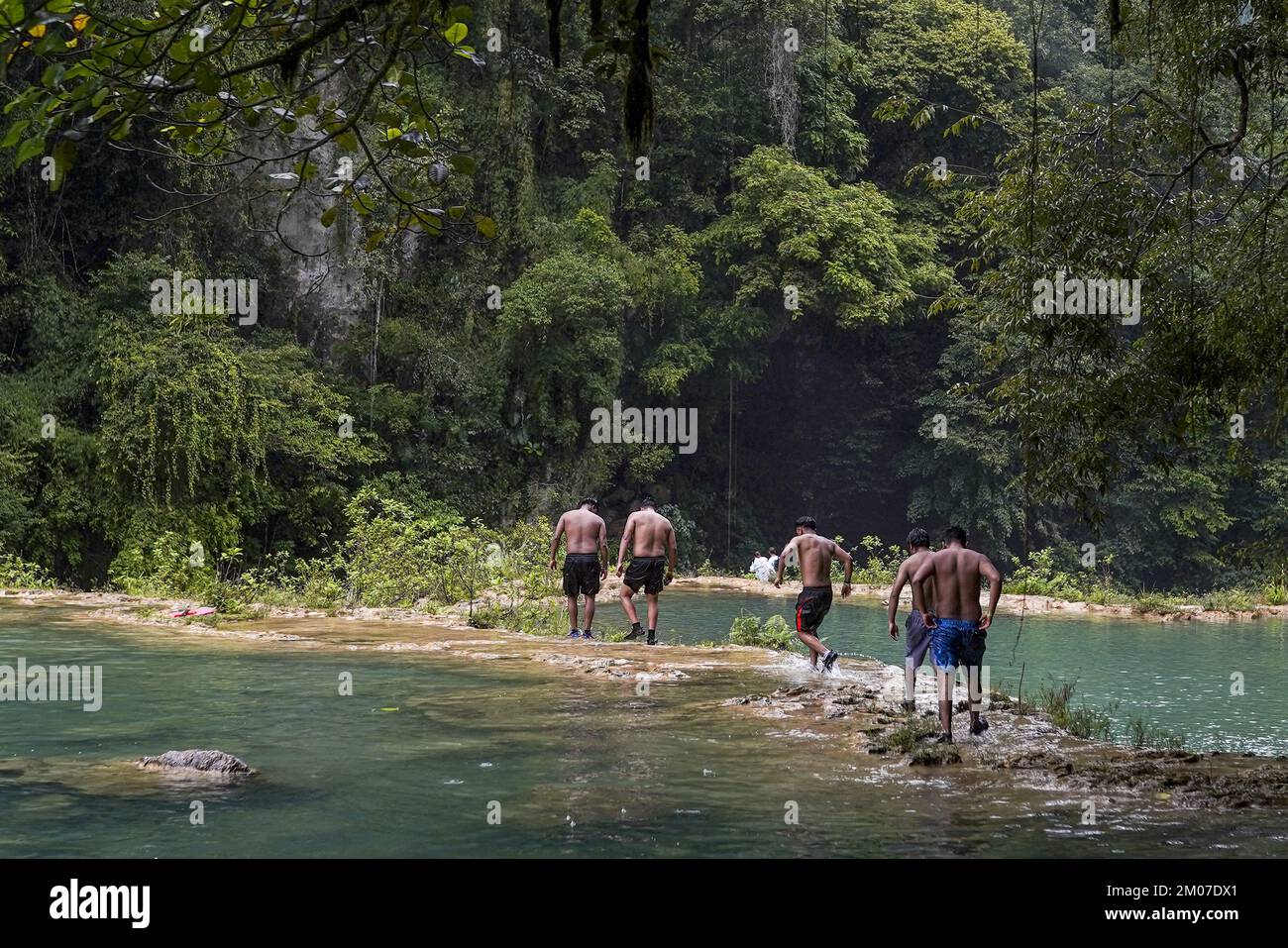 Tourists enjoy Semuc Champey. Semuc Champey is a natural monument with ...