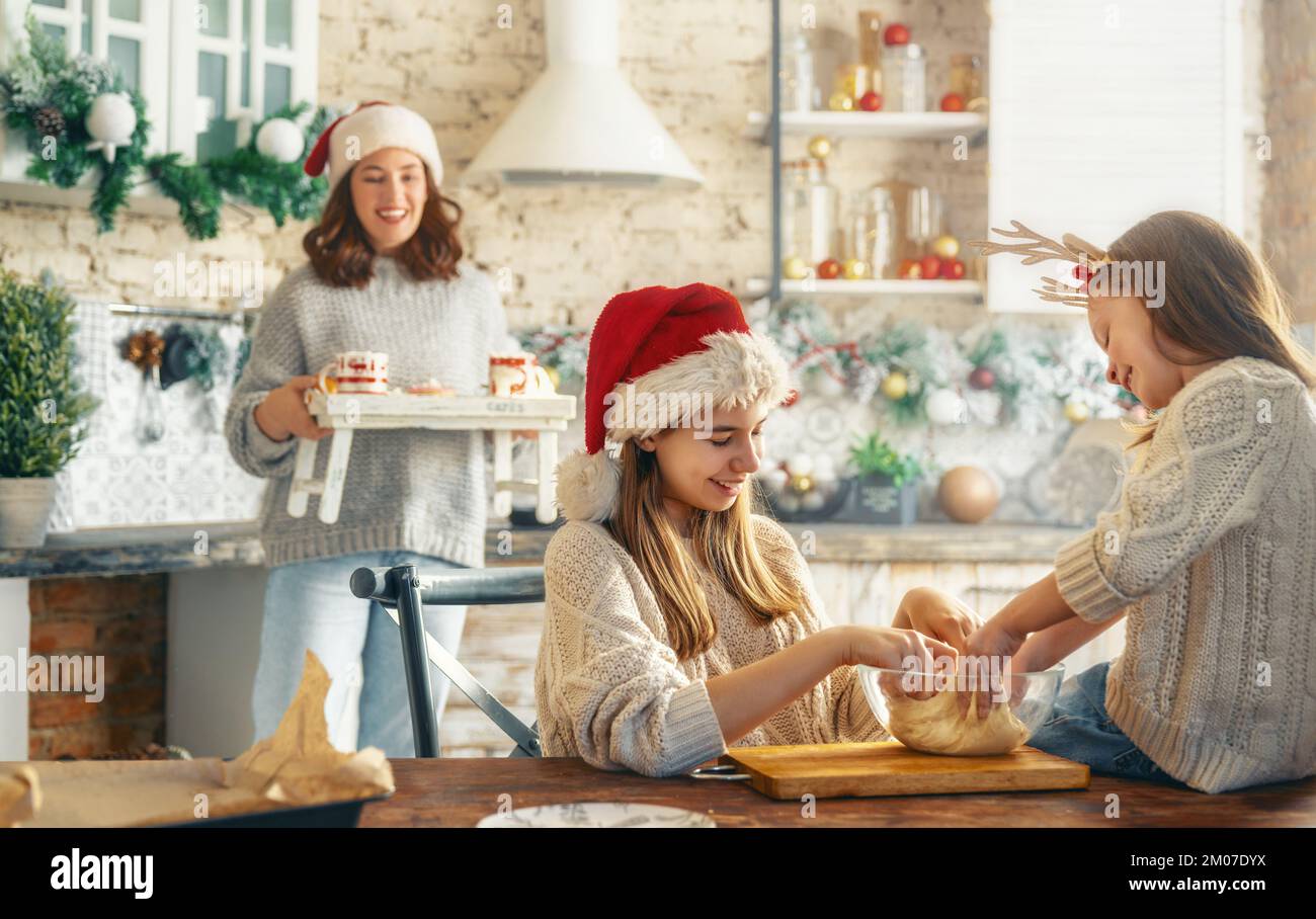 Merry Christmas and Happy Holidays. Family preparation holiday food ...