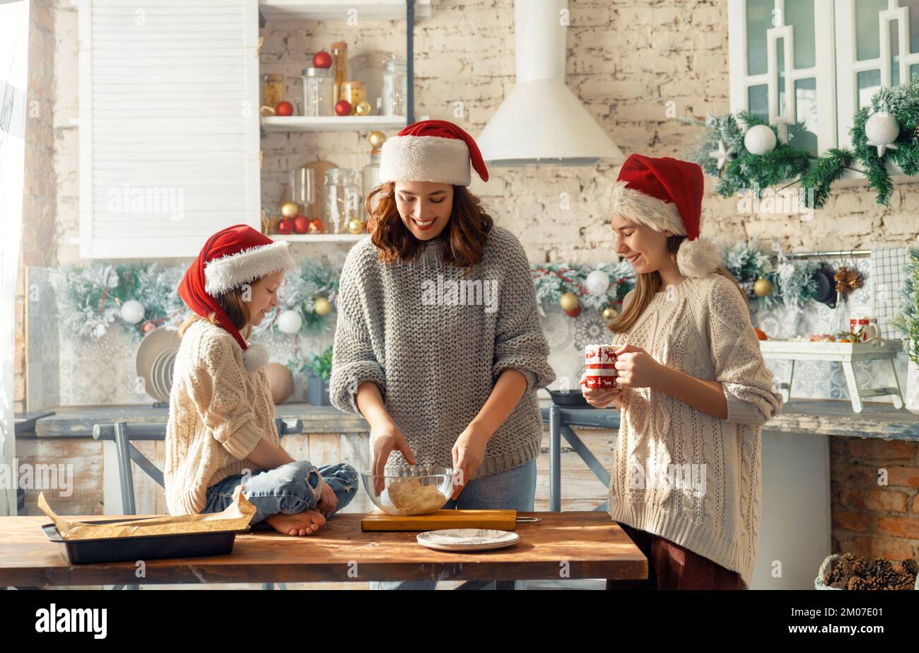 Merry Christmas and Happy Holidays. Family preparation holiday food ...