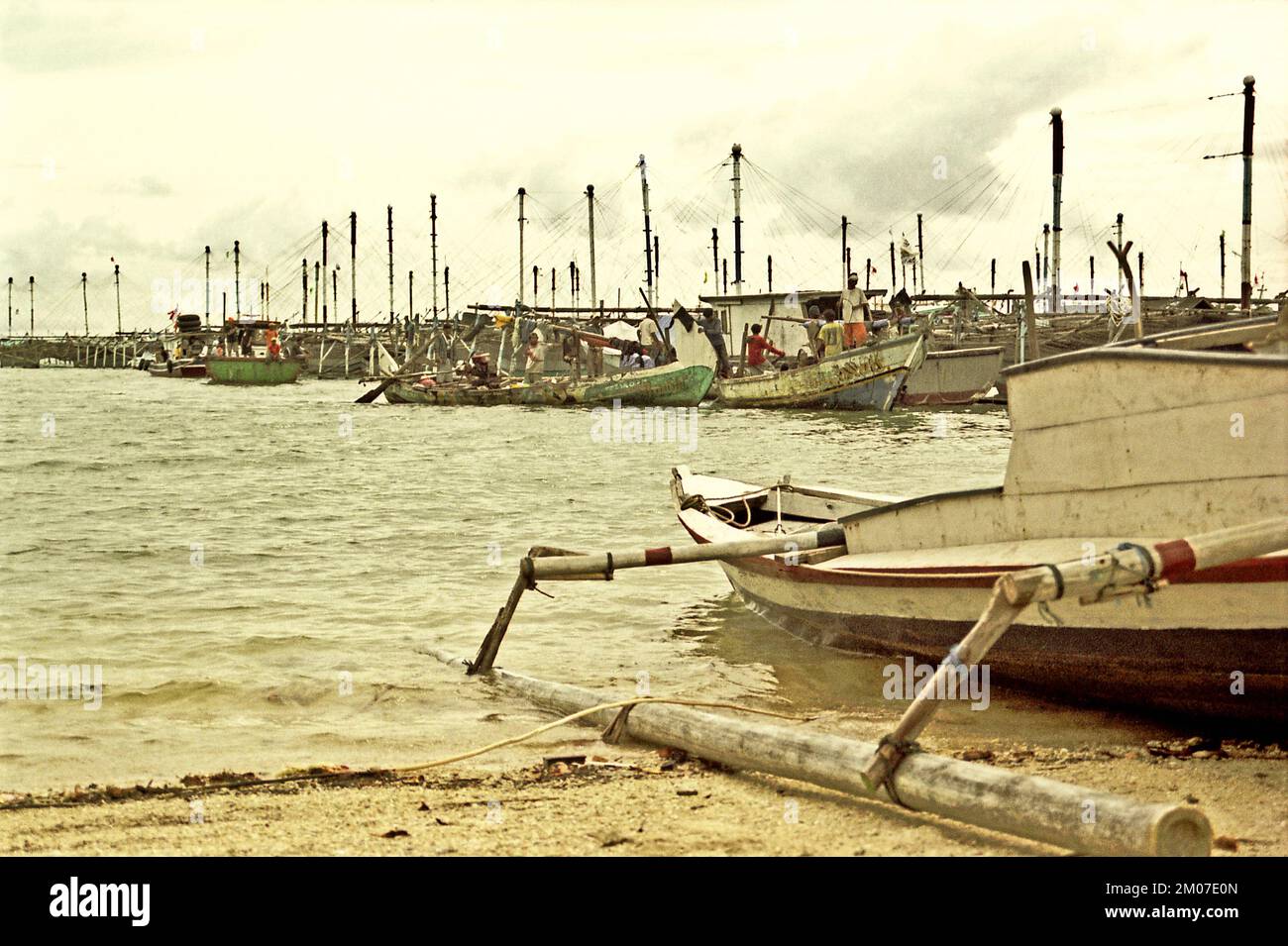 Fishing boats on a fishing beach in Sumur, a coastal town near Ujung ...