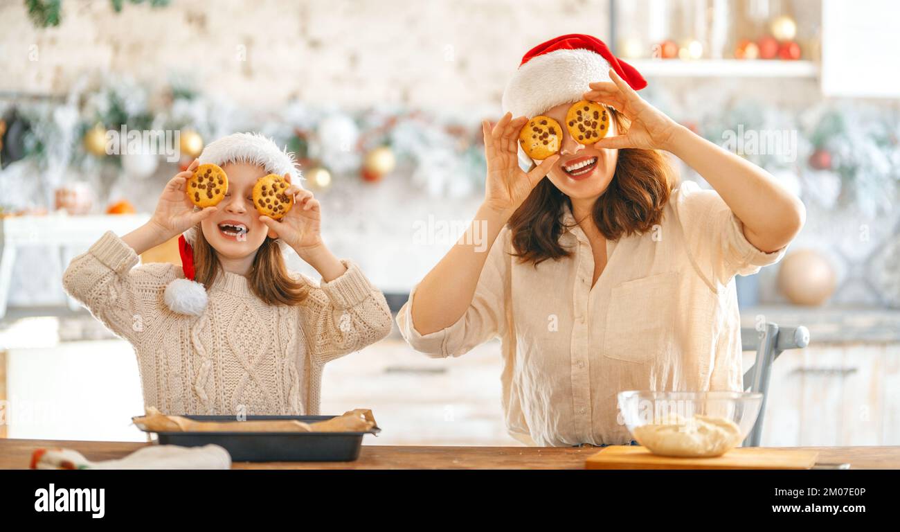 Merry Christmas and Happy Holidays. Family preparation holiday food ...