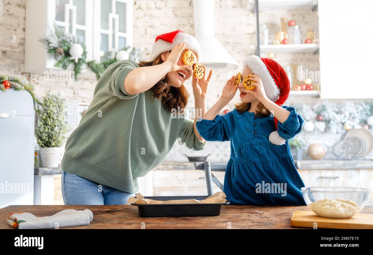 Merry Christmas and Happy Holidays. Family preparation holiday food ...
