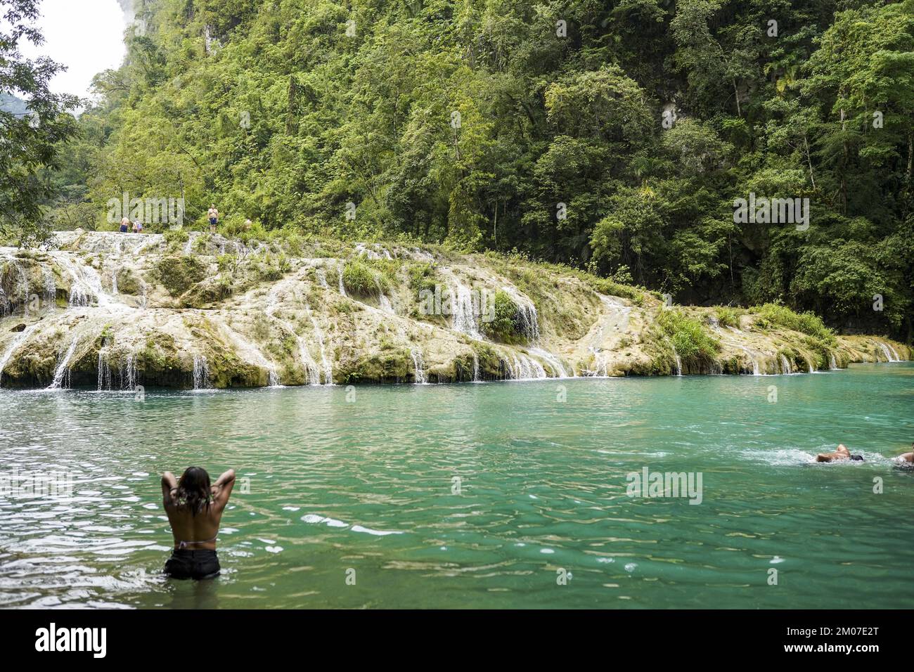 Tourist enjoys Semuc Champey. Semuc Champey is a natural monument with ...