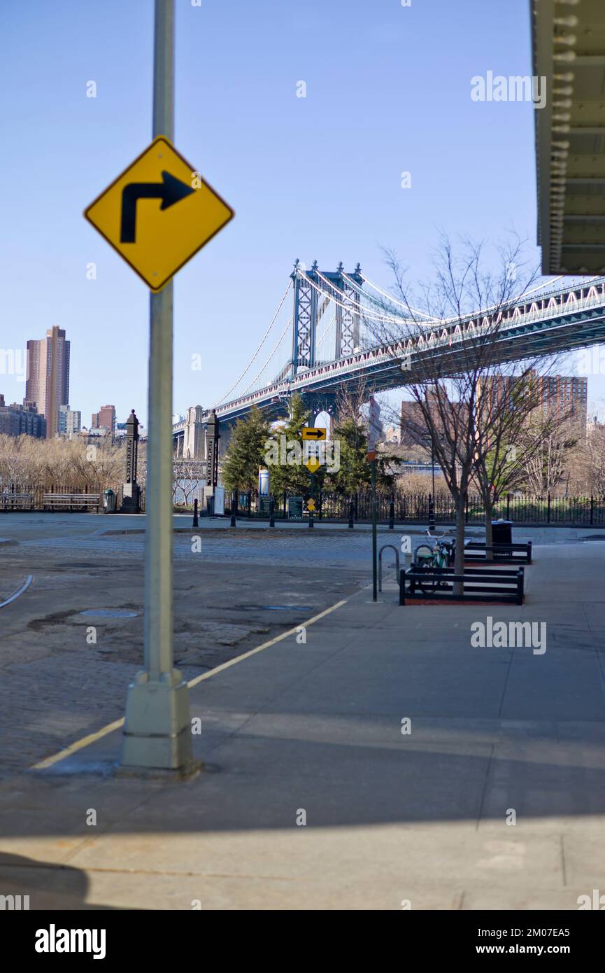 Metal pole with mandatory right turn sign on yellow traffic sign in new ...