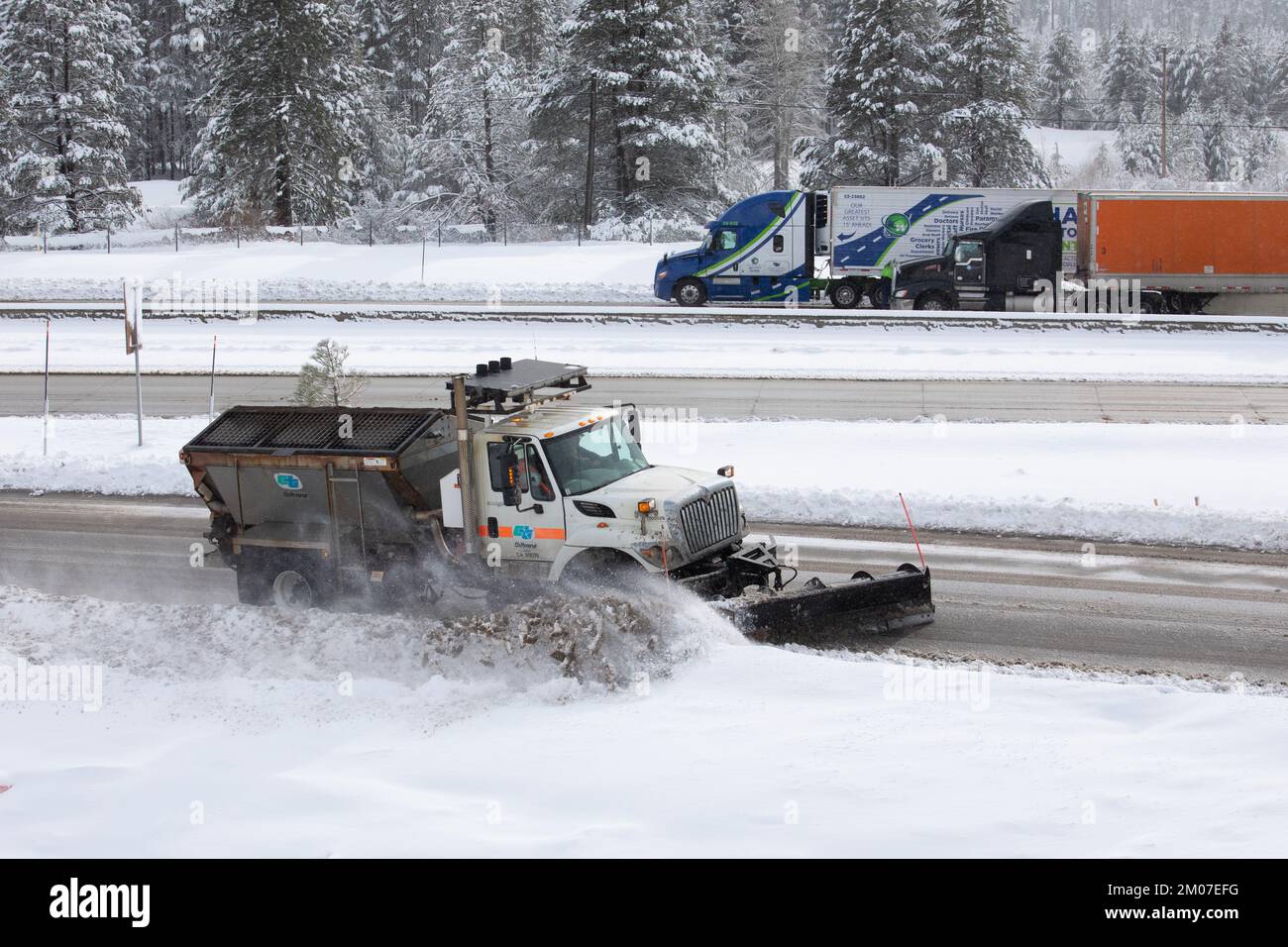 USA. 04th Dec, 2022. A snowplow clears the edge of Highway 80. Heavy ...