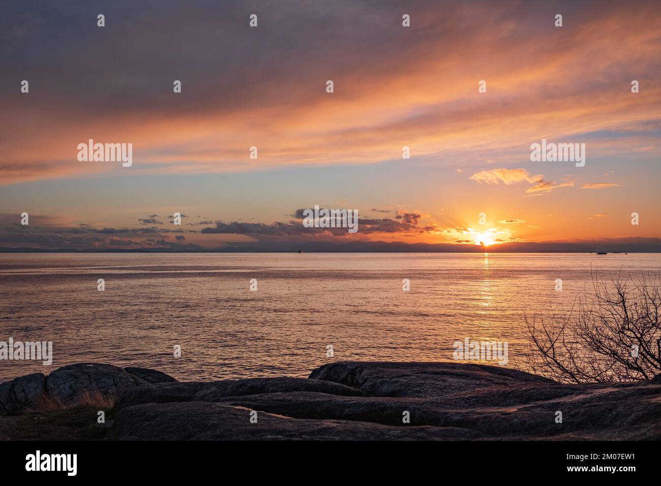 Calm sea with sunset sky and sun through the clouds over. Meditation ...