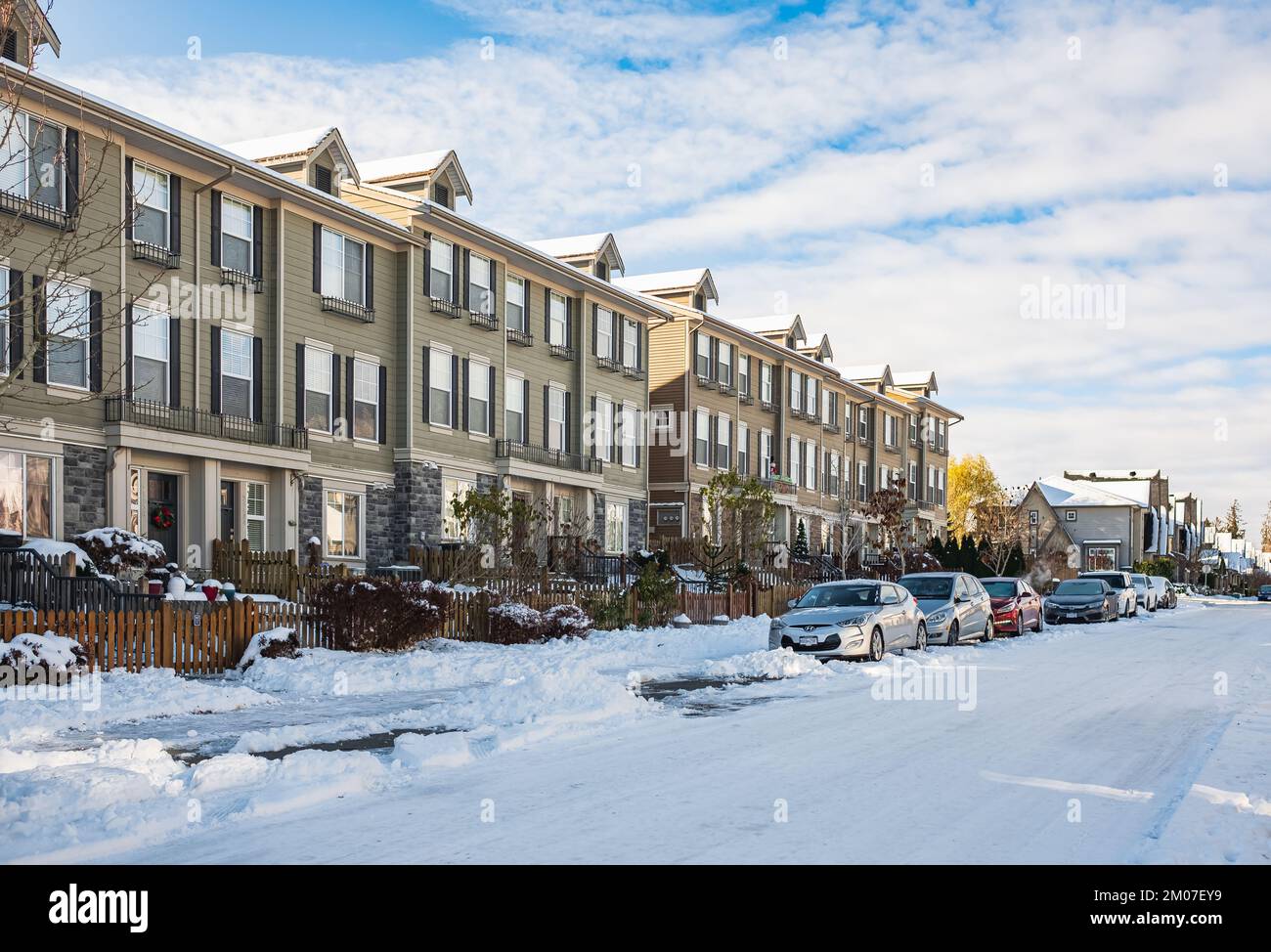 Snow covered residential street after heavy snow fall over night. Early ...