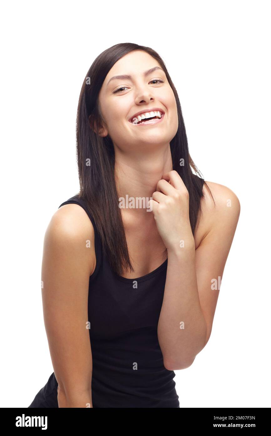Stop making me laugh. A cute young woman laughing while isolated on a ...