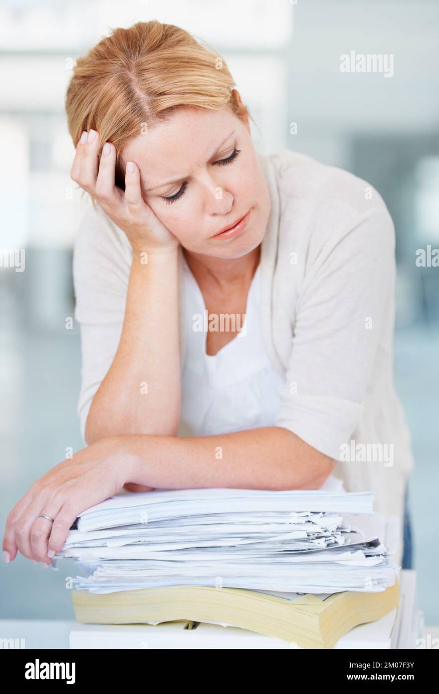 Businesswoman leaning on pile hi-res stock photography and images - Alamy