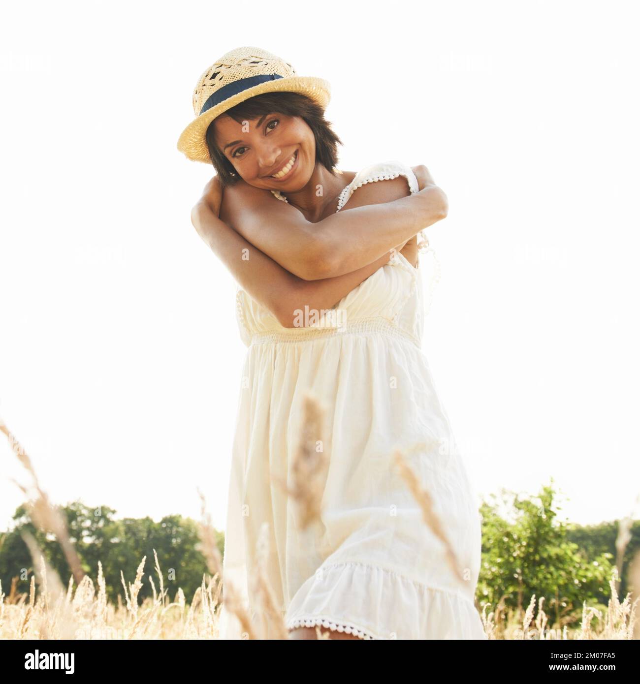 Feeling the benefits of the summer sun. Portrait of a pretty woman in ...