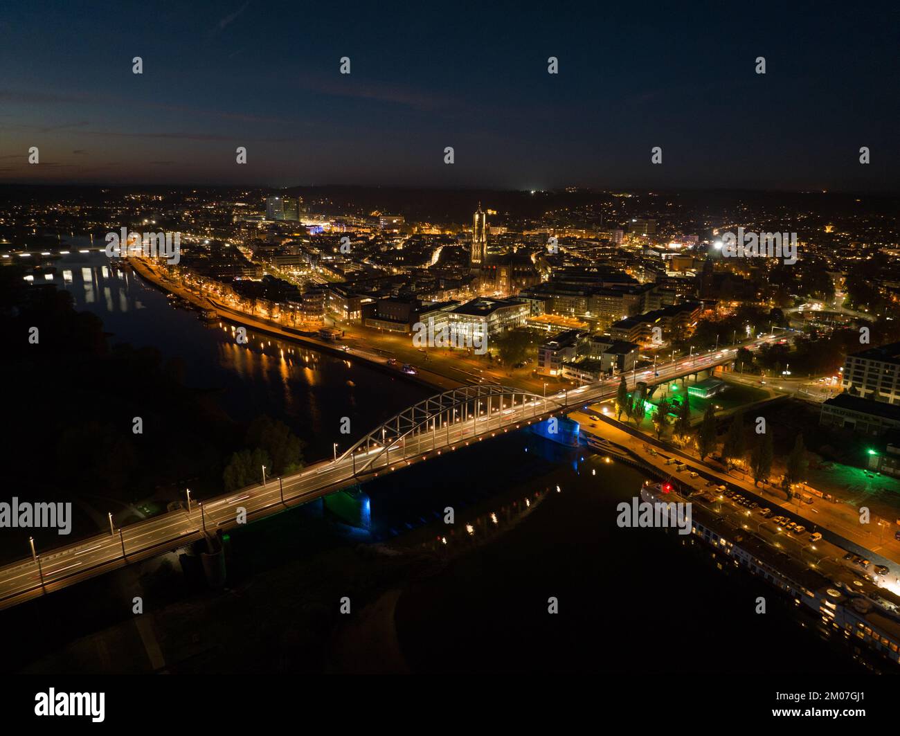 Arnhem city in the Netherlands by night Aerial drone. City center ...