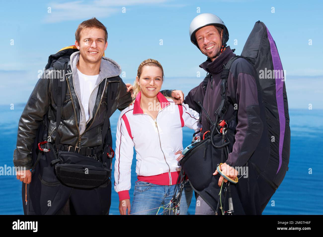 Ready for some paragliding. Three para gliders posing for the camera ...