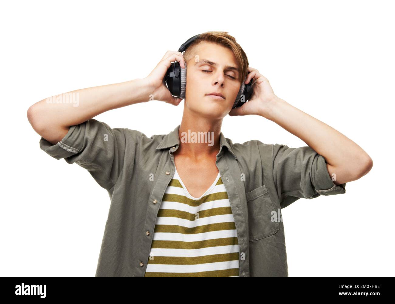 Music is what feelings sound like. a young man listening to music Stock ...