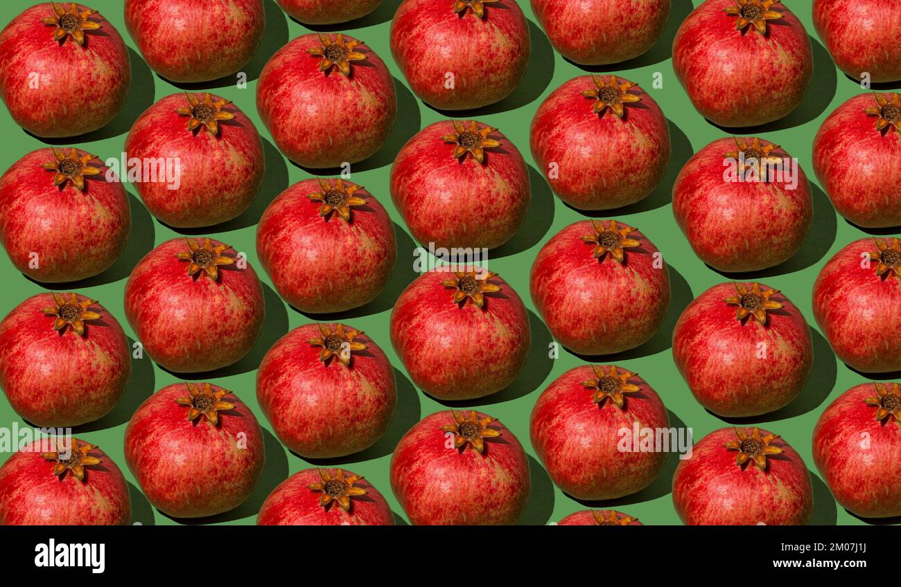 Pomegranate pattern. Red pomegranates on a green background. Fruit food ...