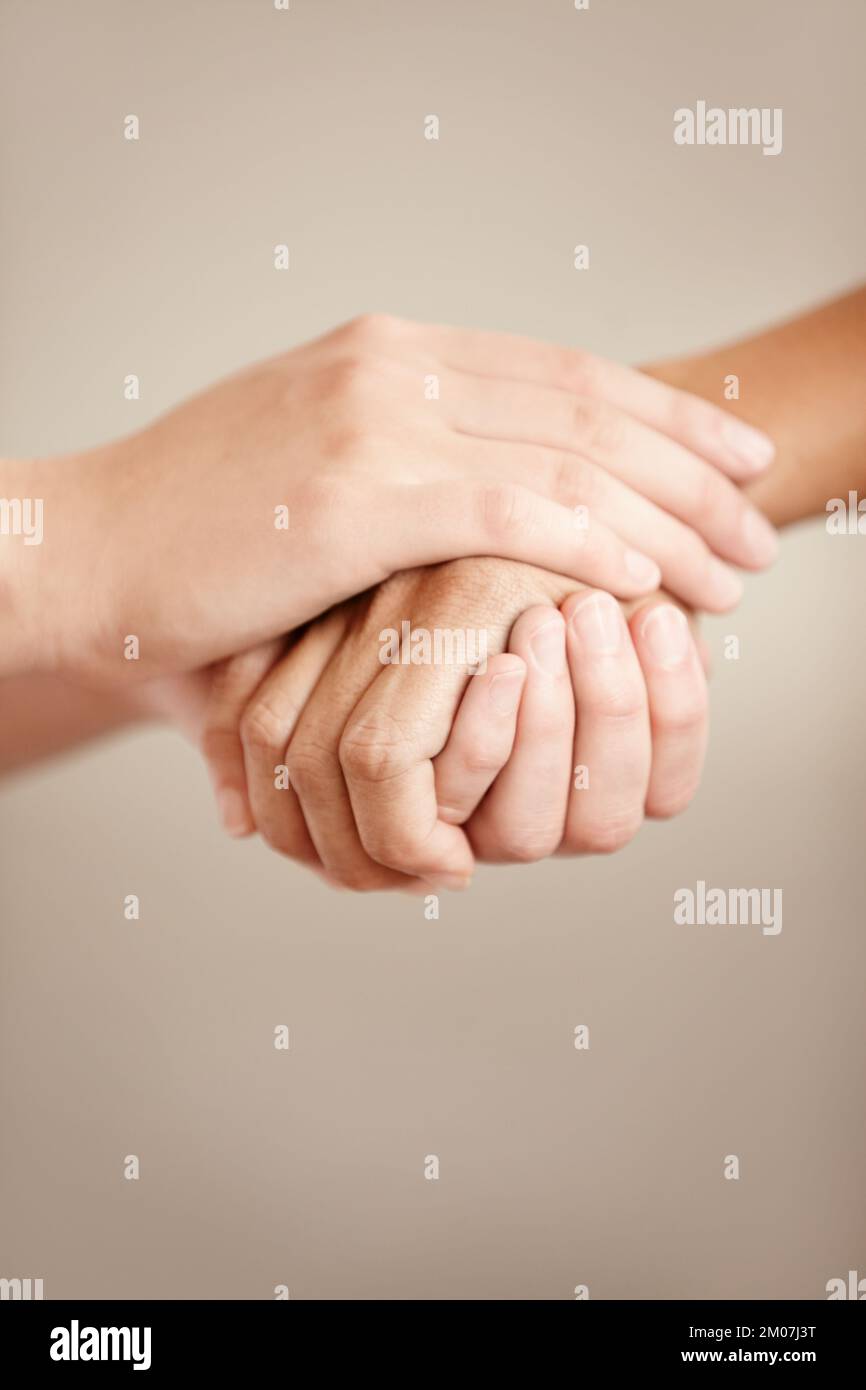 In the end only kindness matters. two people holding hands in comfort ...