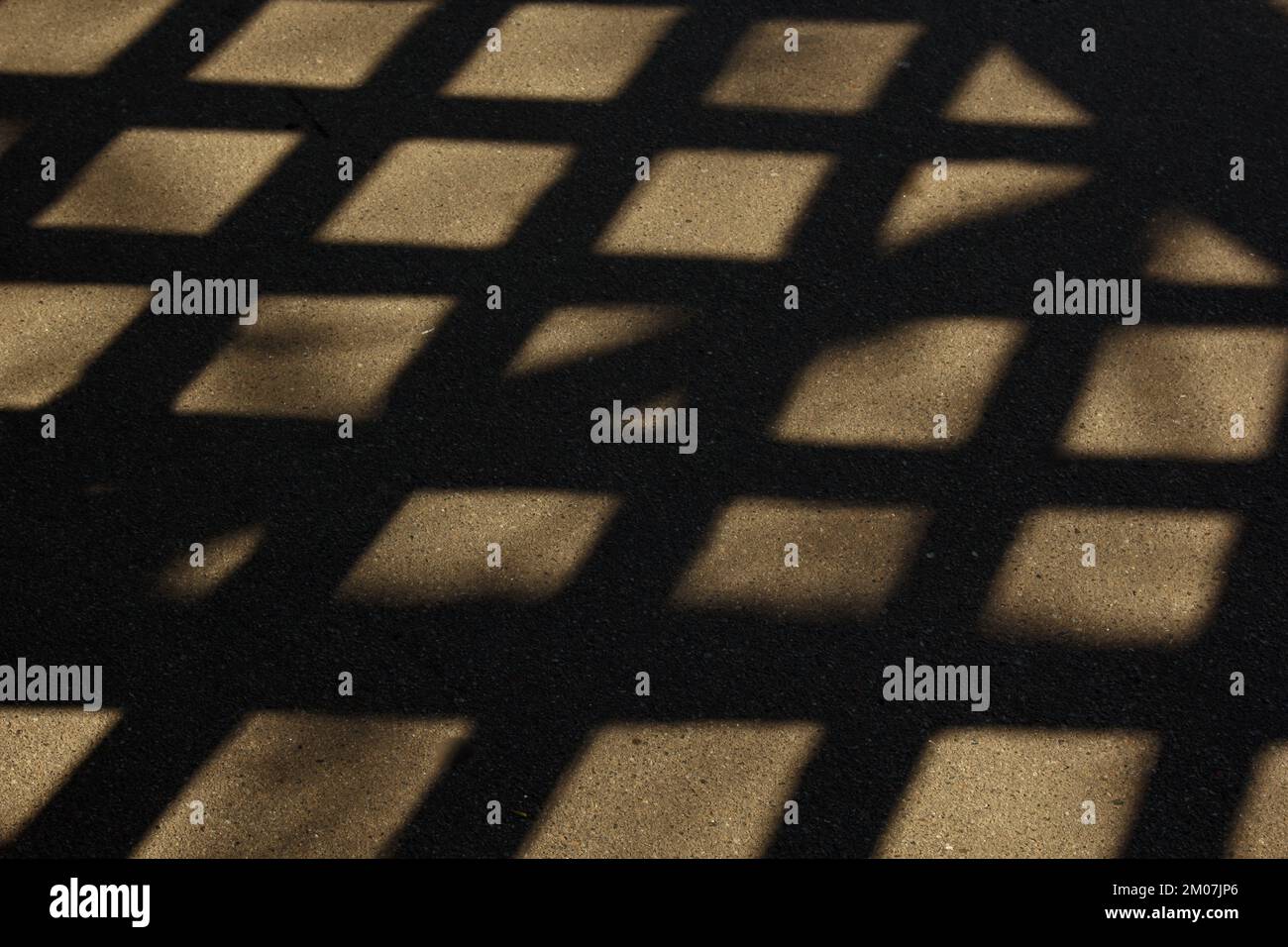 geometric shadows from the grid on the ground. view from above ...