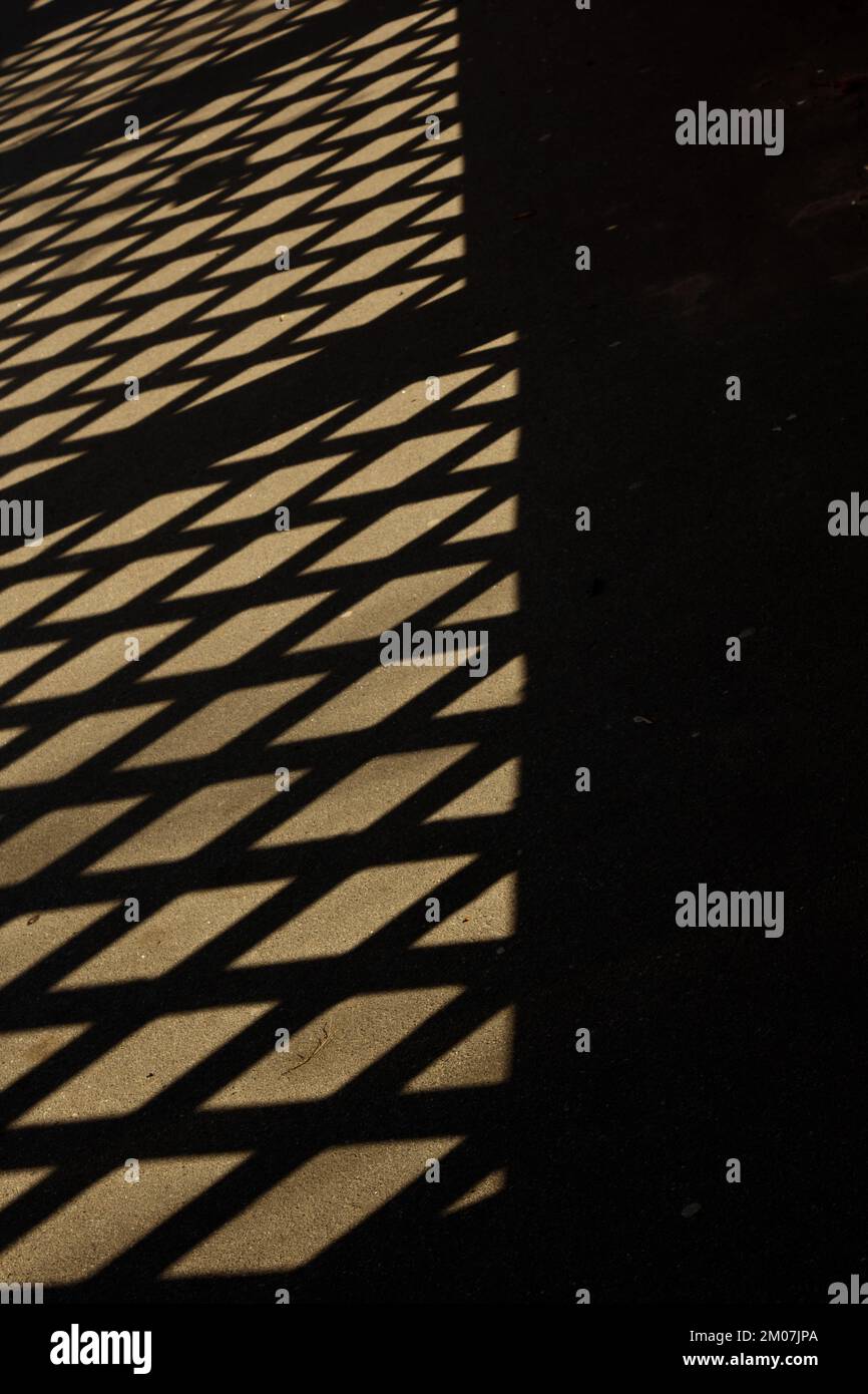 geometric shadows from the grid on the ground. view from above ...