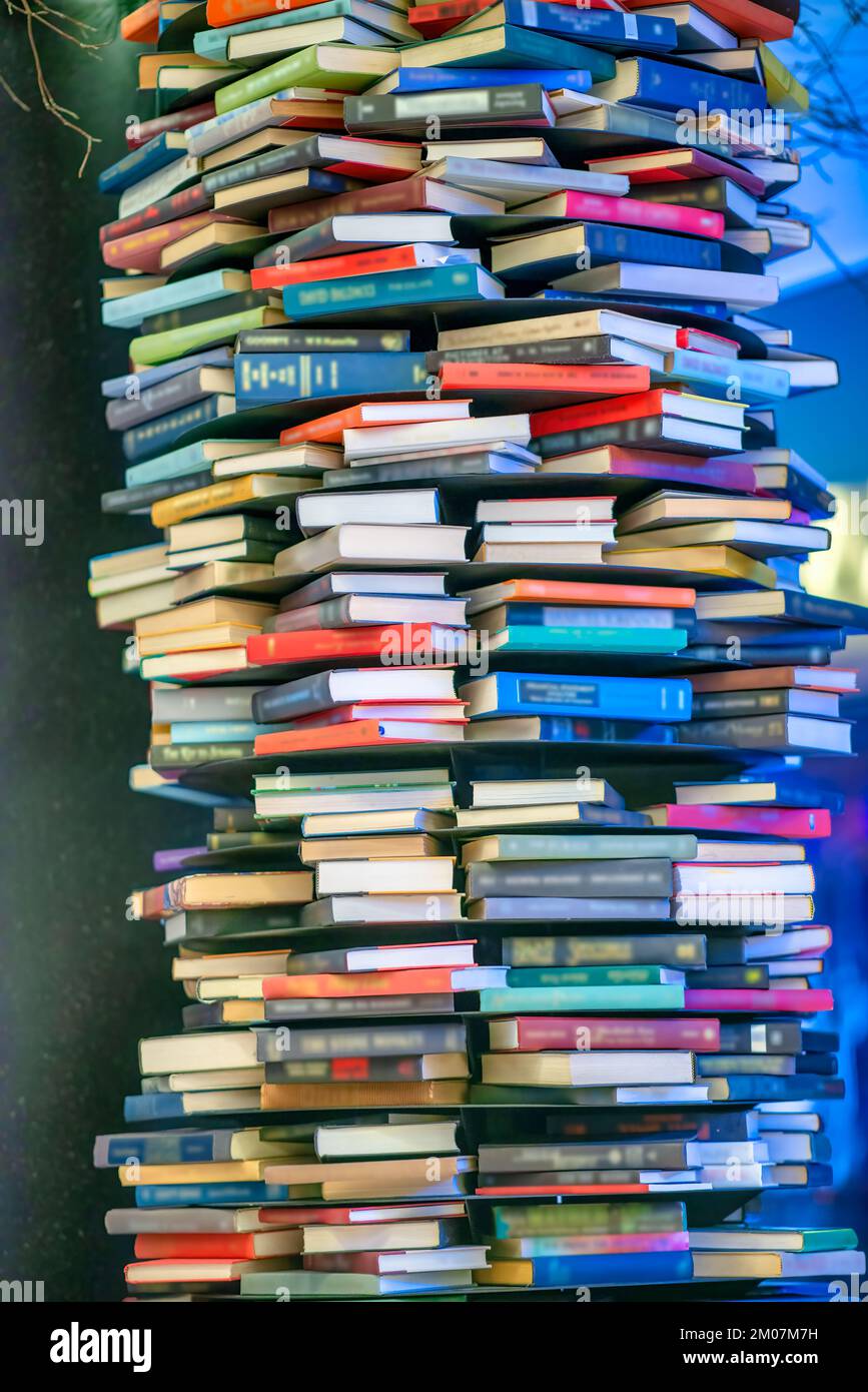 Stack of old books in a book store, side view of many books ...