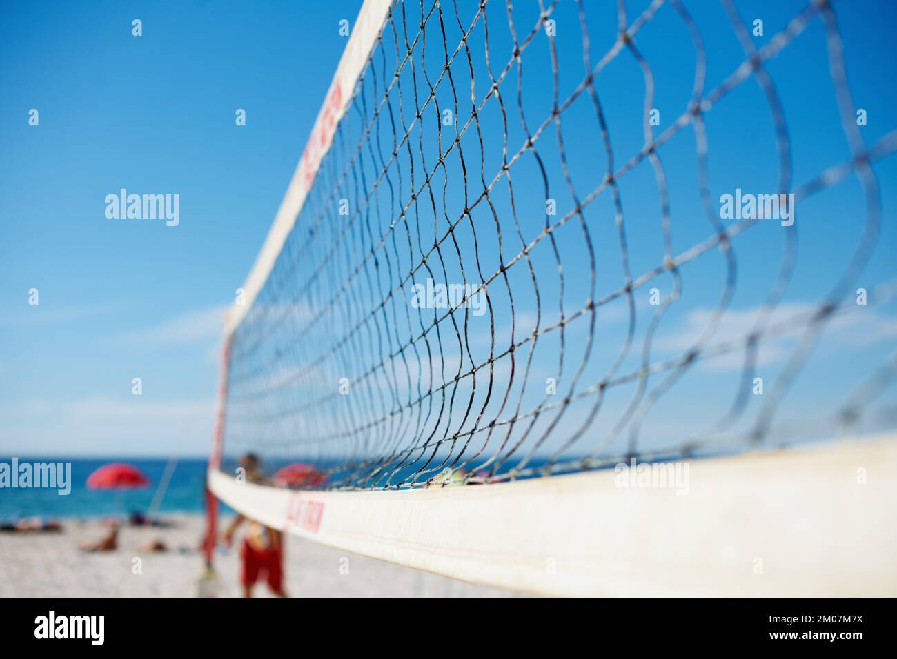 An essential part of the game. a volleyball net on a beach Stock Photo ...