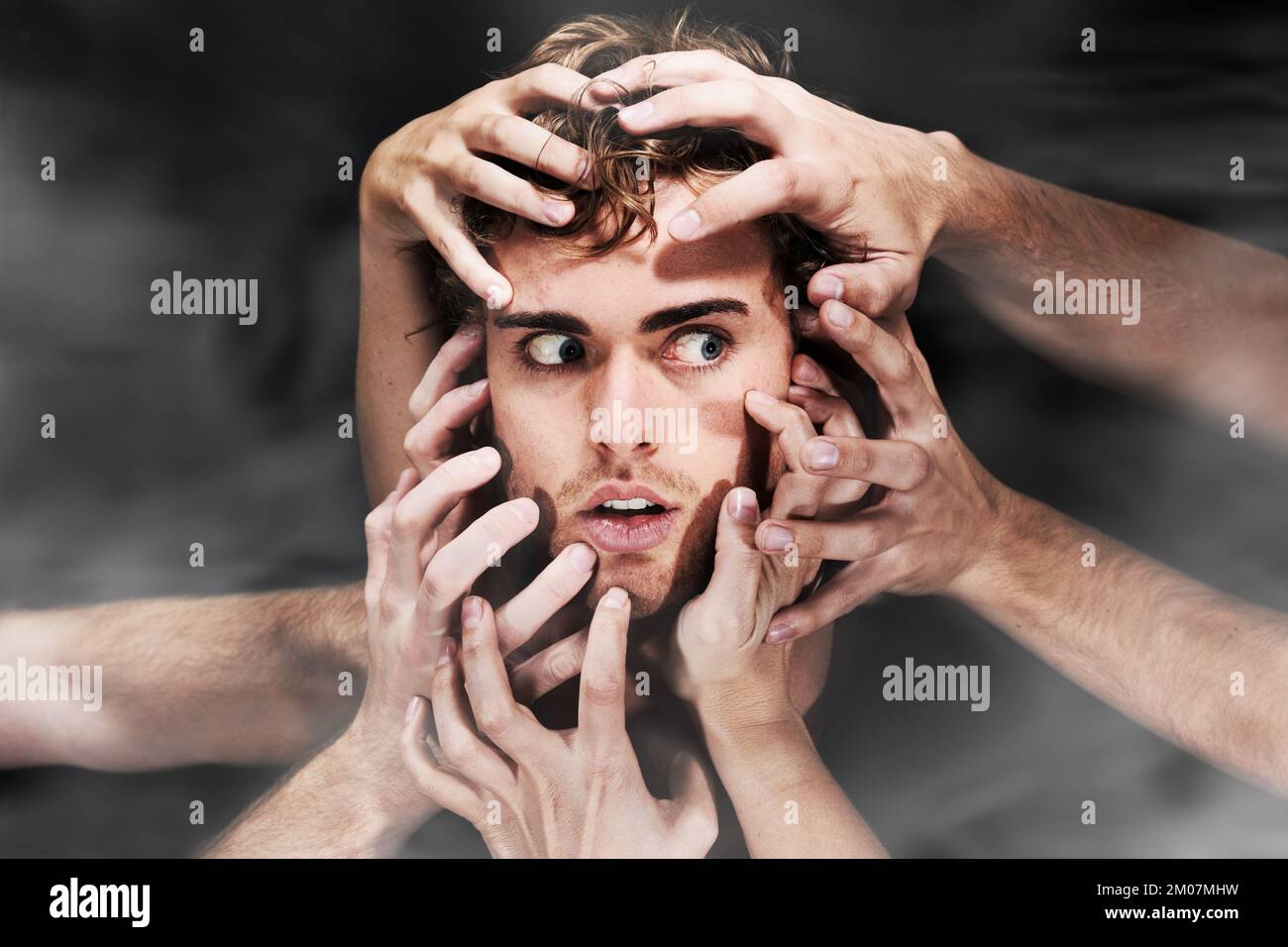 They all want him. A mans head being grabbed from all sides by many ...