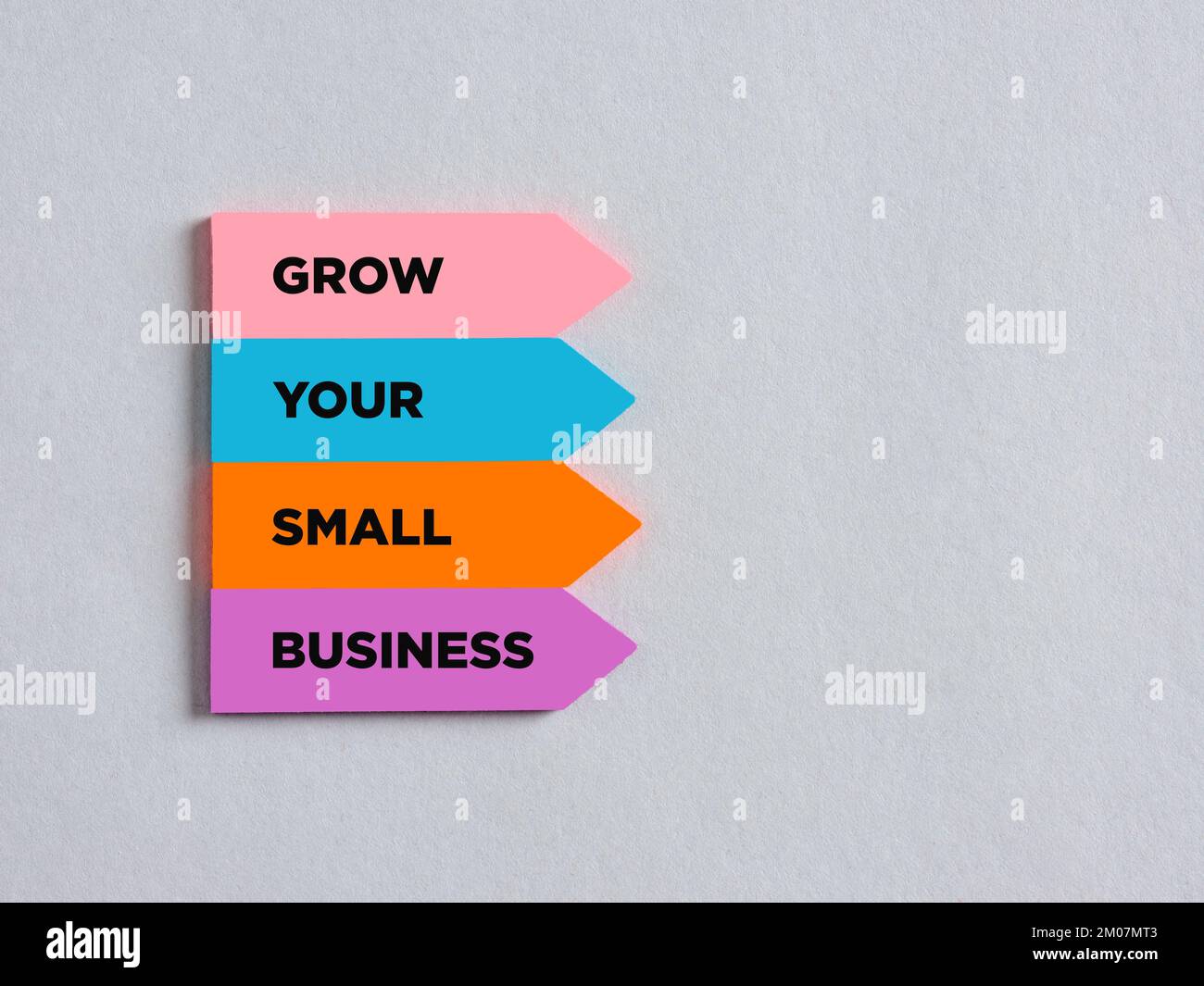 Colorful arrow shaped stickers with the message grow your small ...