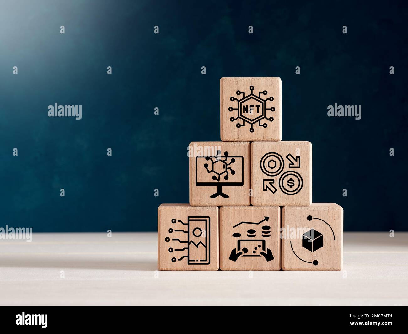 Non fungible token NFT transaction icons on a wooden cube pyramid Stock ...