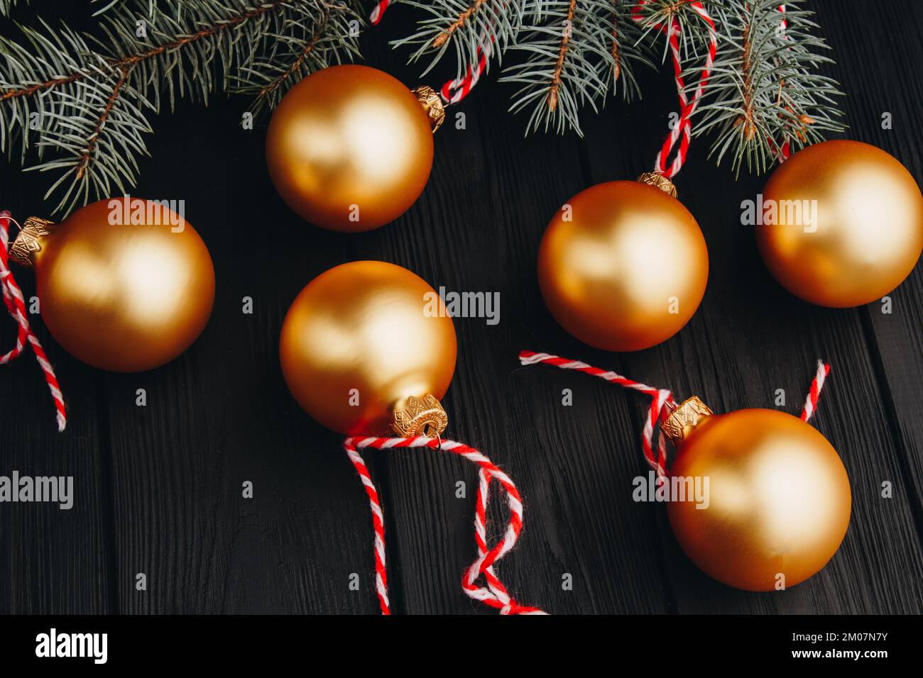 Colored christmas decorations on black wooden table. Xmas balls on ...
