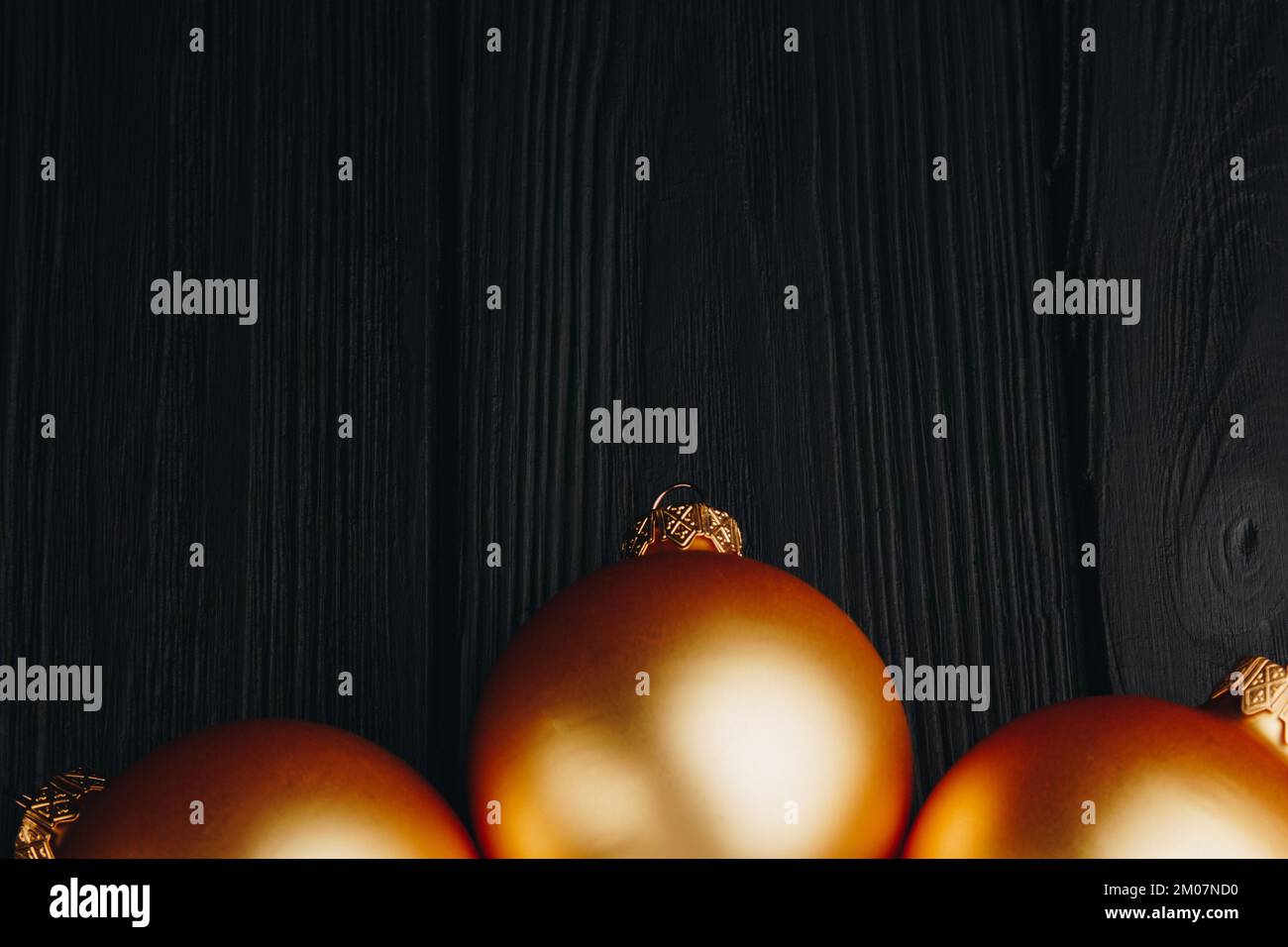 Colored christmas decorations on black wooden table. Xmas balls on ...