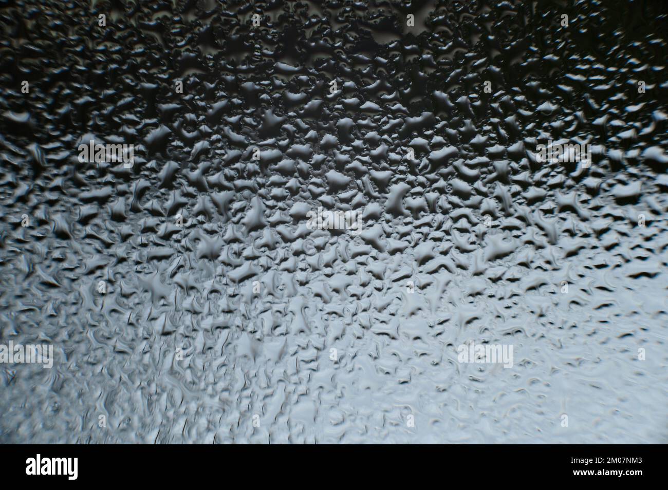 Close-up of condensation with water drops on the glass, texture of ...
