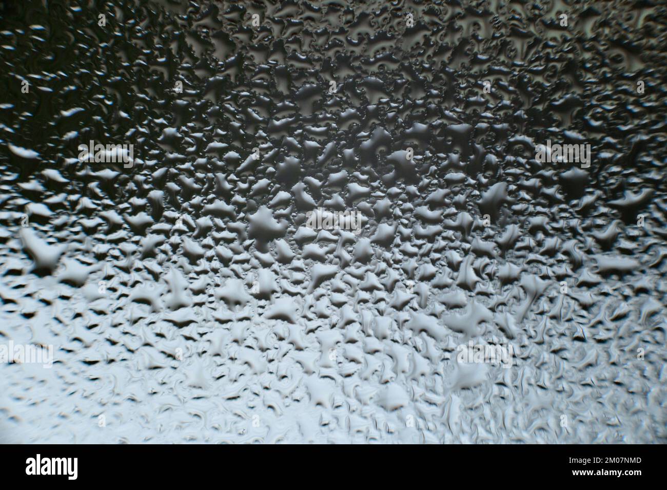 large drops of dew on the window after condensation on the window ...