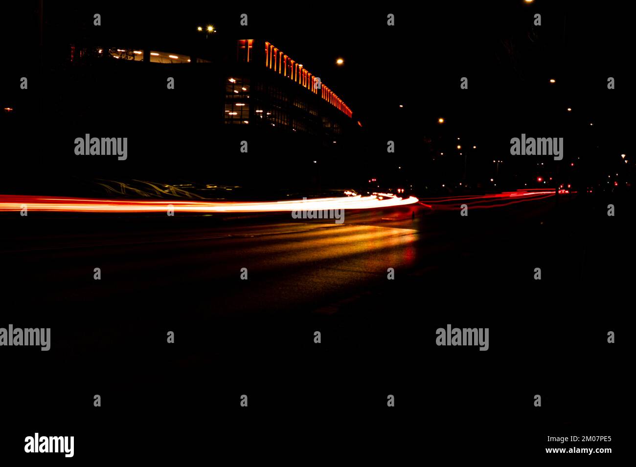 Lights of cars at night. Street line lights. Night highway city. Long ...