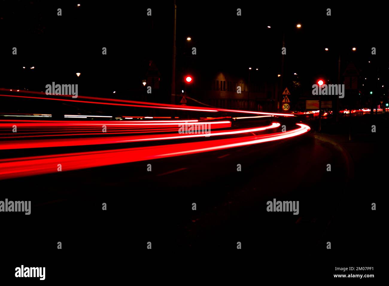 Lights of cars at night. Street line lights. Night highway city. Long ...