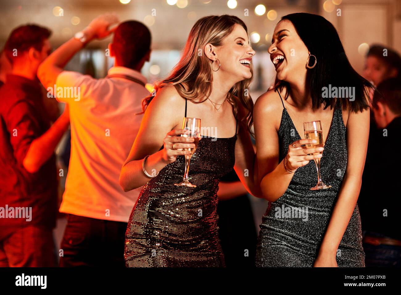 Women, laughing or bonding in champagne night party, clubbing event or birthday celebration in ...