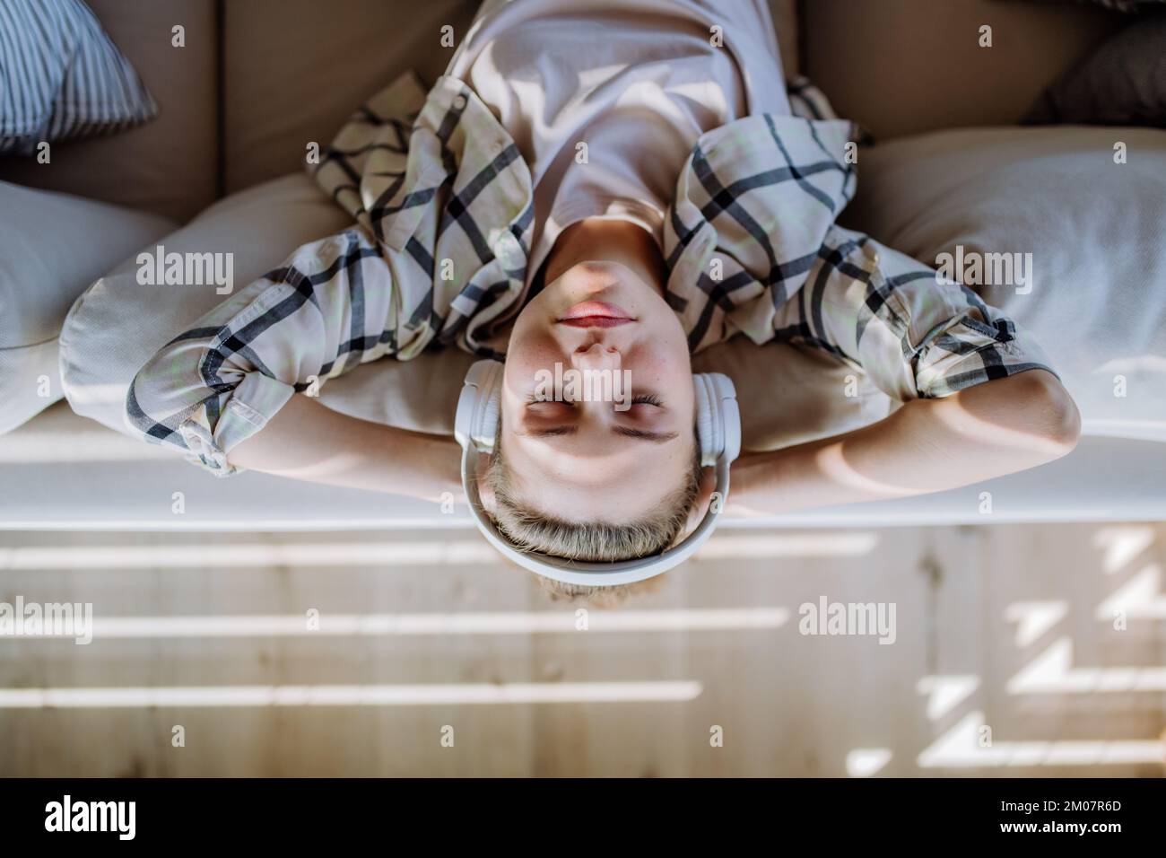 Top view of young woman relaxing with headphones, listening music Stock ...