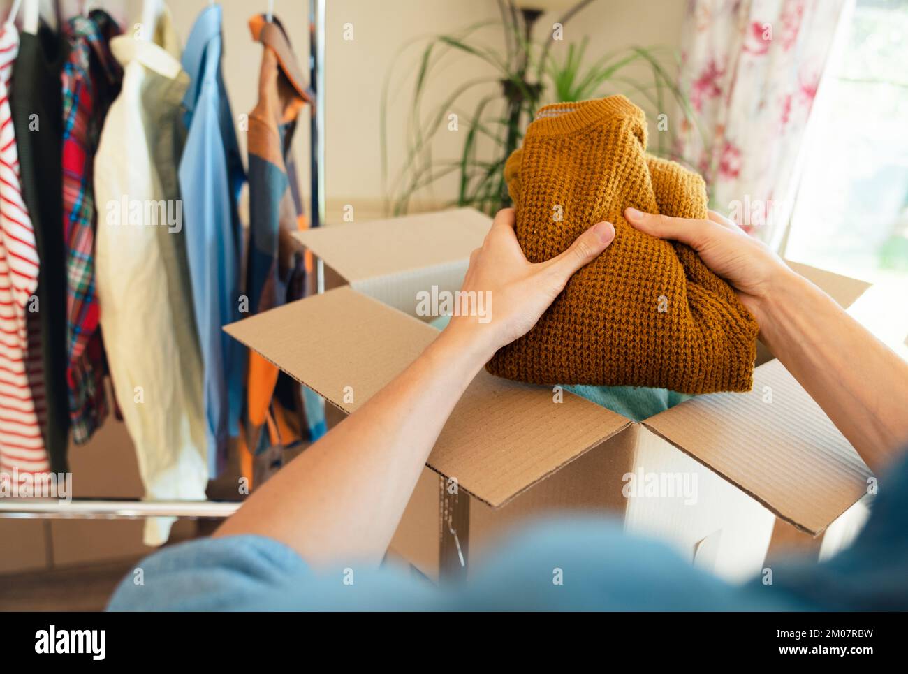 Pre owned clothes resale or donation Stock Photo - Alamy