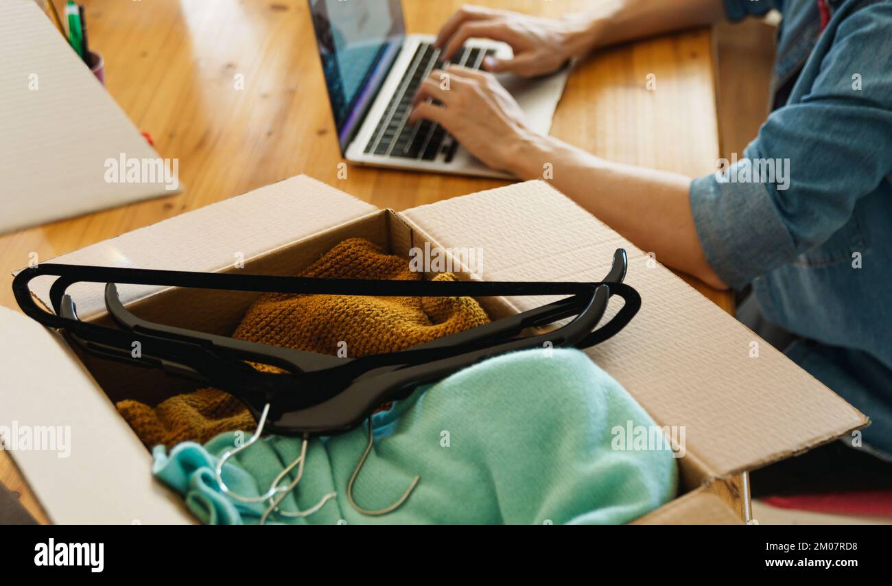 Pre owned clothes resale or donation Stock Photo - Alamy