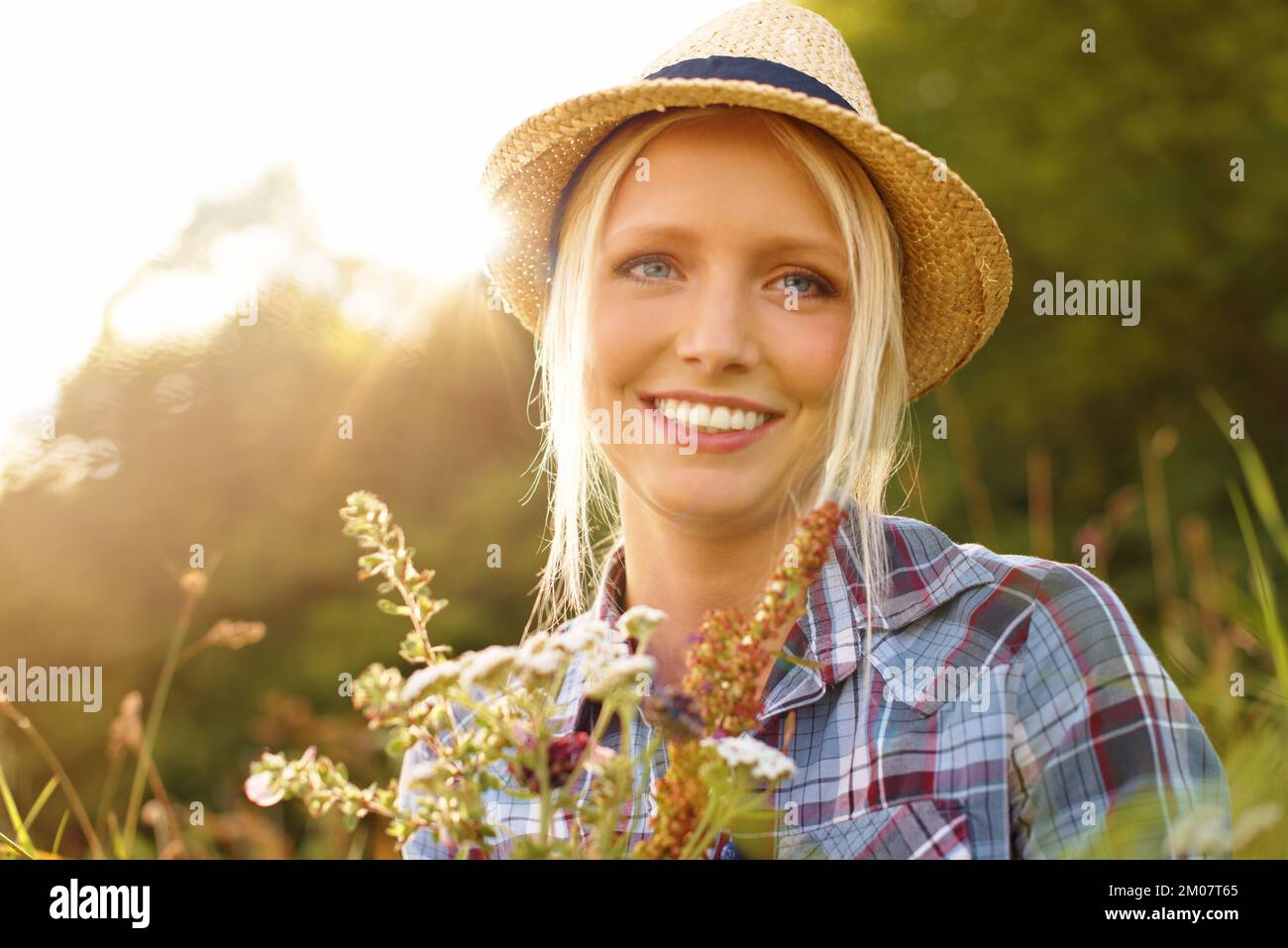 Nature is my definition of beautiful. Beautiful young woman in a field ...