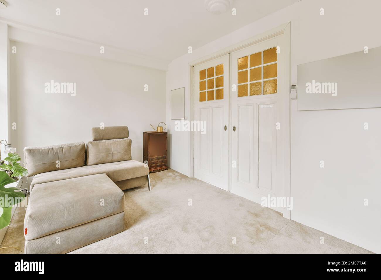 Comfortable chair placed near desk with computer monitors and ...