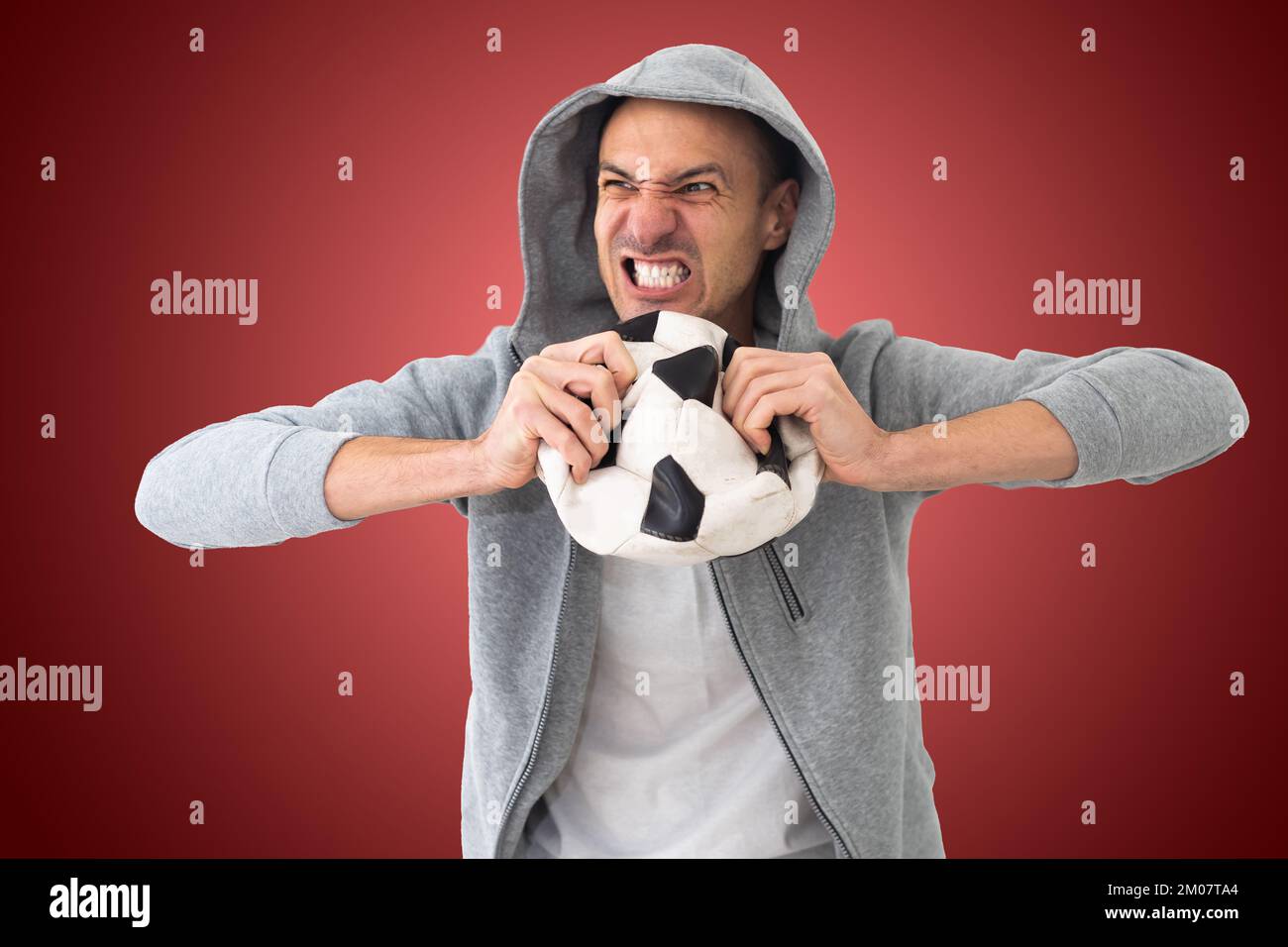 football fan with a deformed ball Stock Photo - Alamy